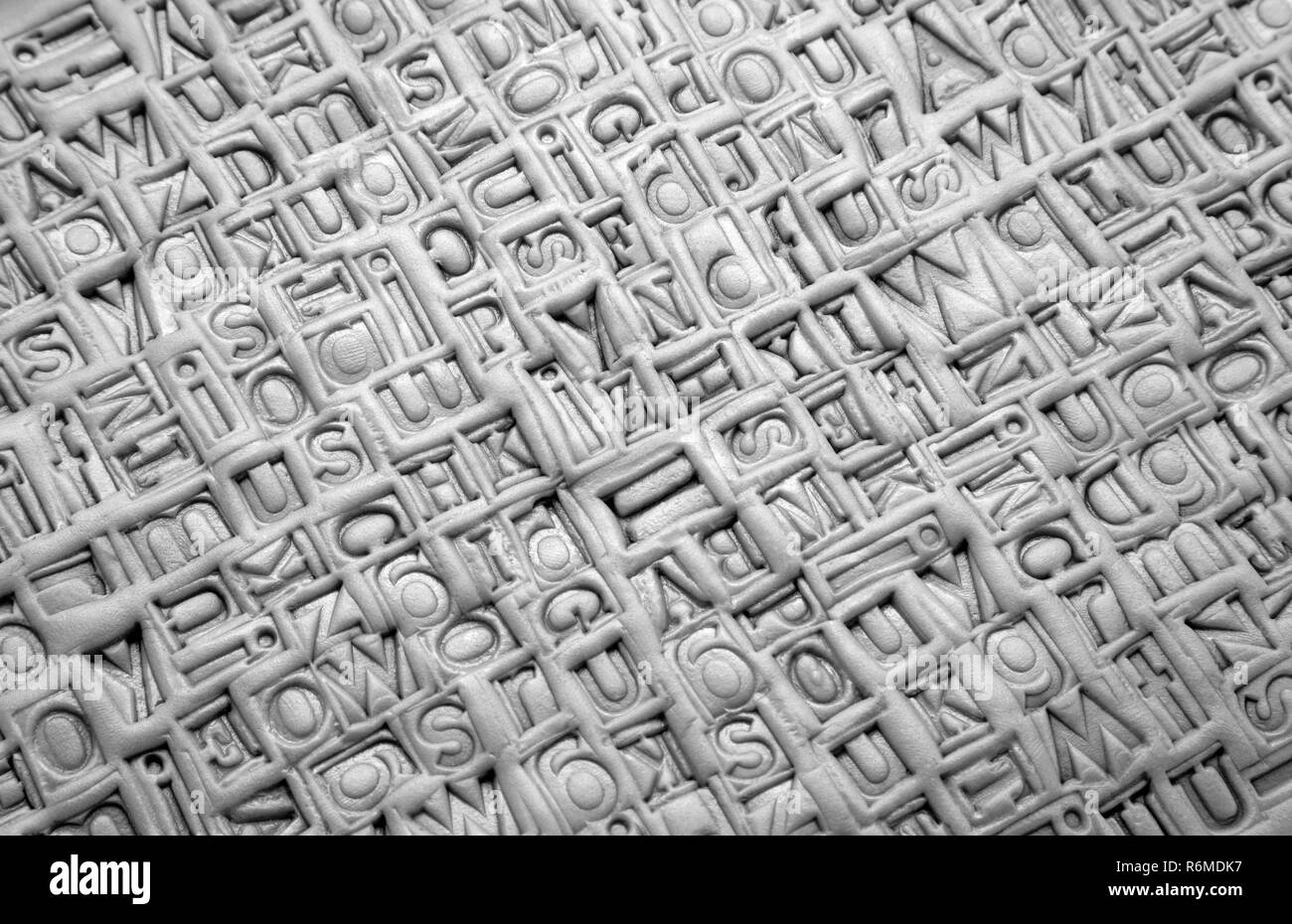 Old letterpress blocks background. Imprinted in modeling clay Stock ...