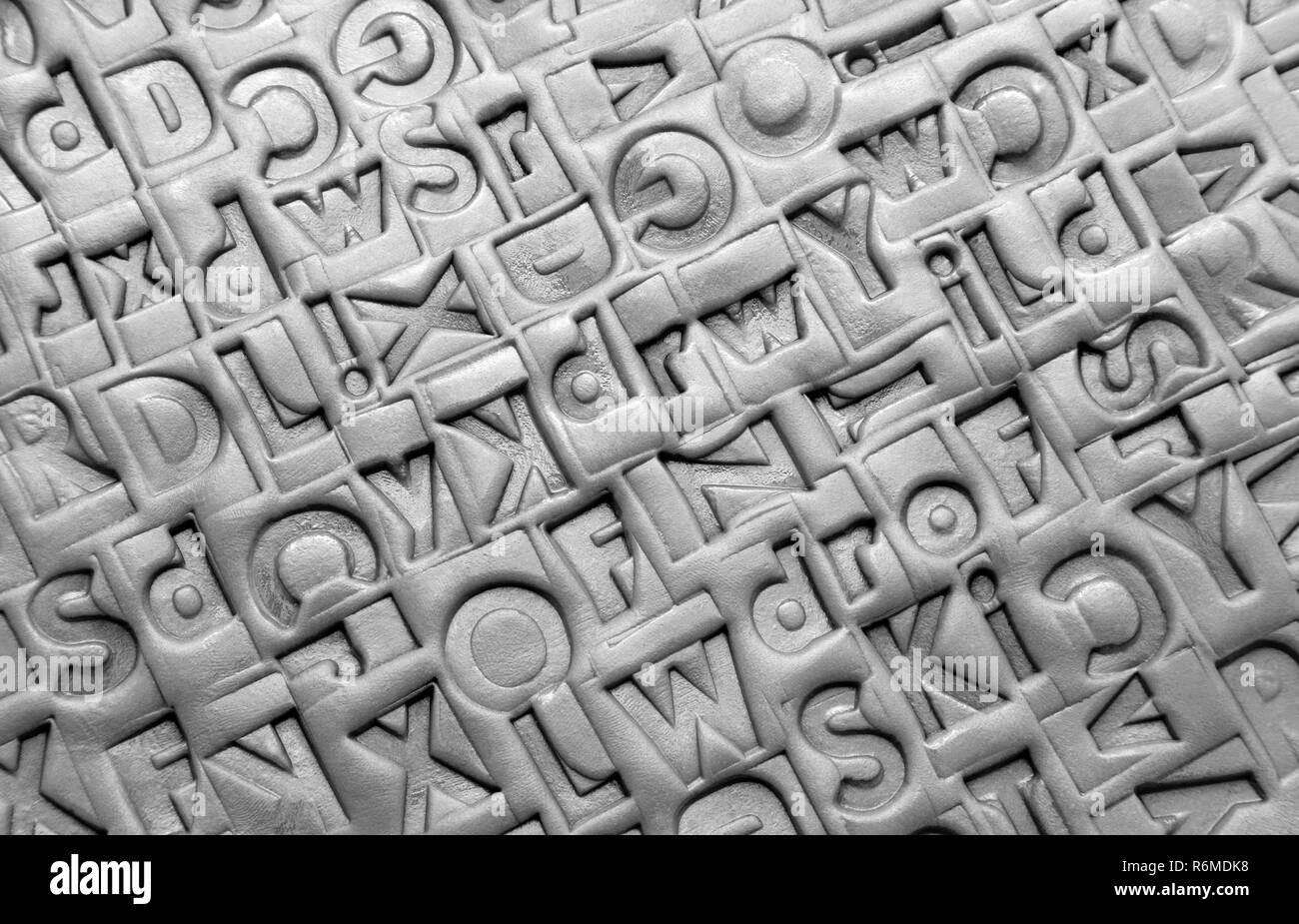 Old letterpress blocks background. Imprinted in modeling clay Stock ...