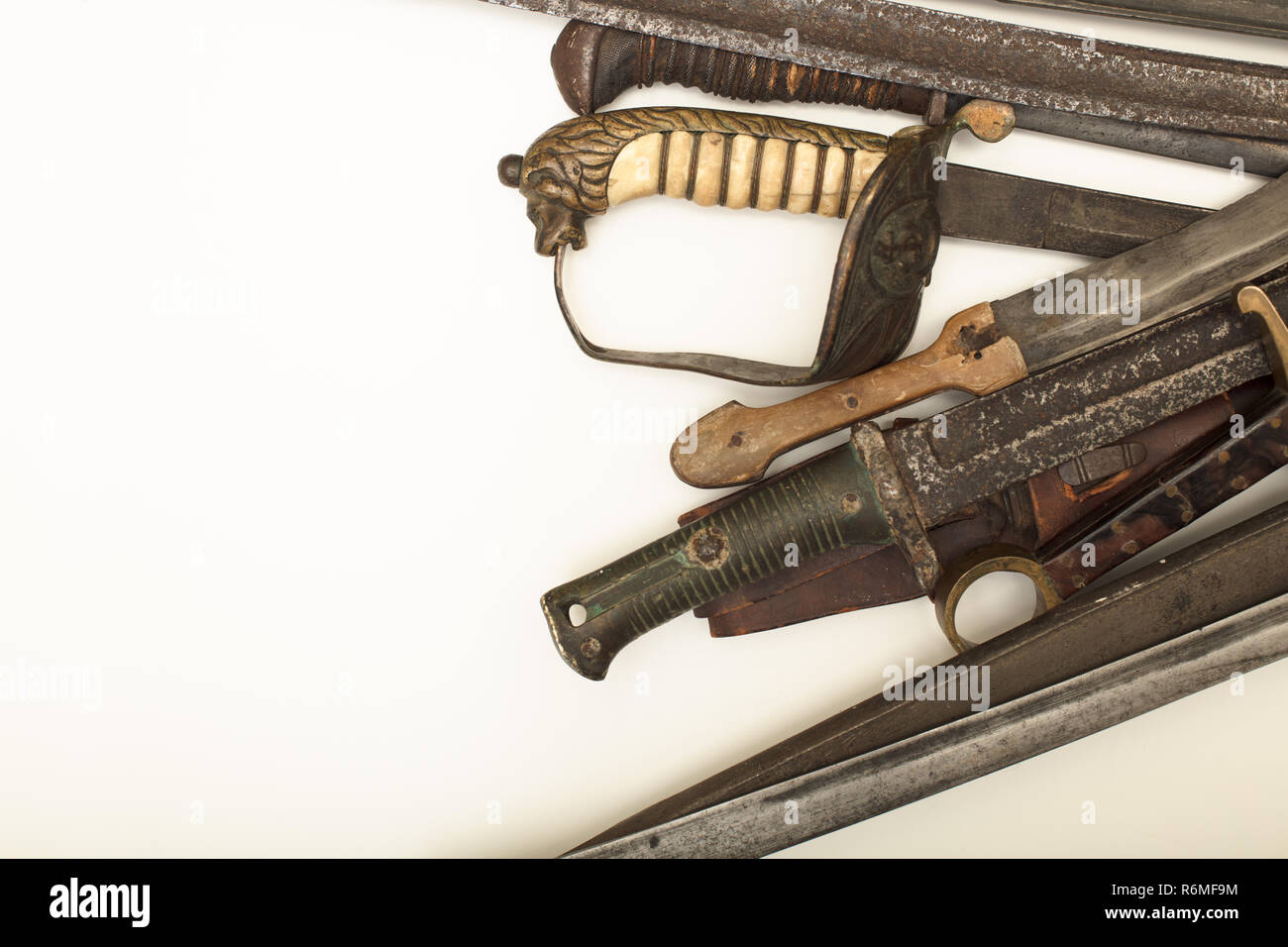 Collection of hilts of old swords and daggers Stock Photo - Alamy