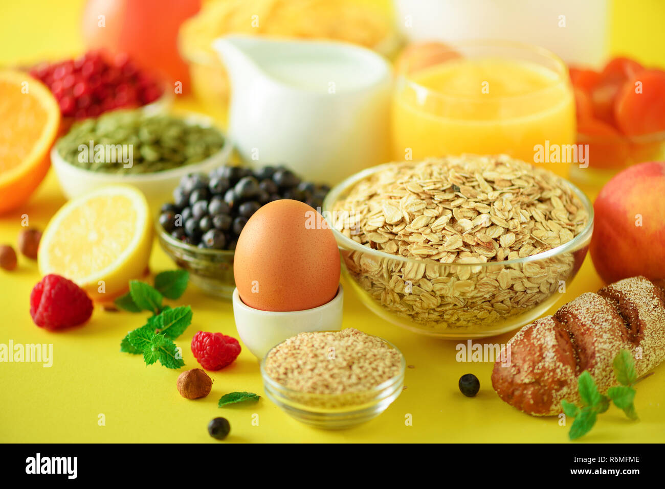 Delicious breakfast ingredients. Soft boiled egg, oat flakes, nuts ...