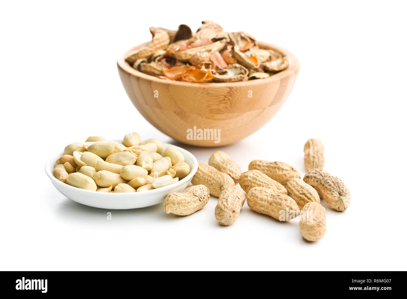 Bowl unpeeled peanuts Cut Out Stock Images & Pictures - Alamy