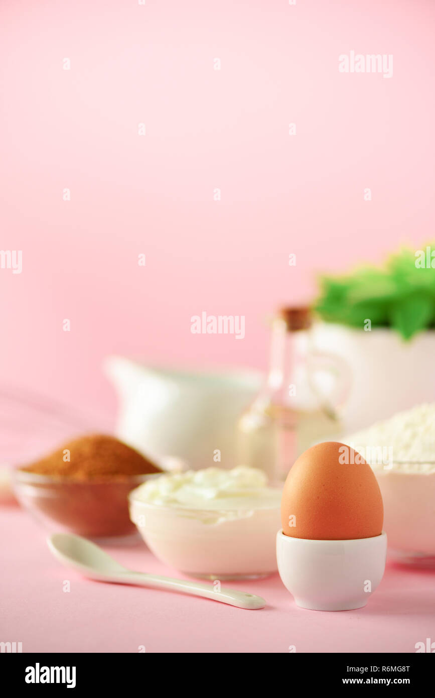 White cooking utensils on pink background. Food ingredients. Macro of ...