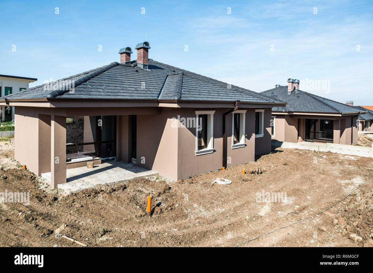 New build houses. Sunny day. Construction site Stock Photo - Alamy