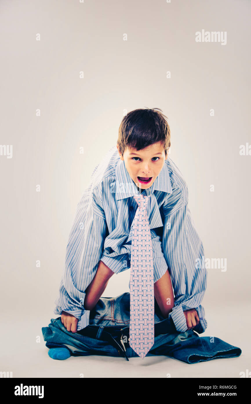 funny boy wearing Dad's clothes Stock Photo - Alamy