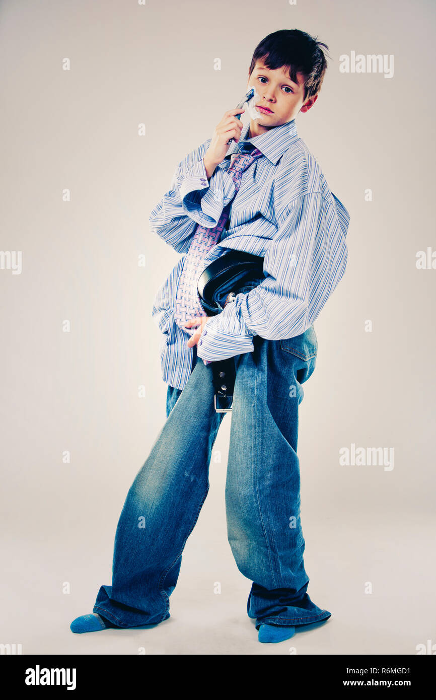 funny boy wearing Dad's clothes Stock Photo - Alamy