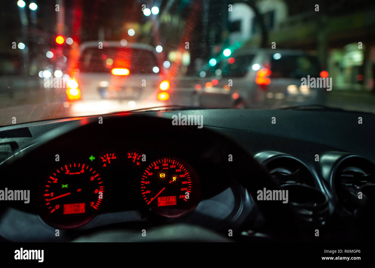 Car dashboard and window at night. Traffic lights Stock Photo - Alamy