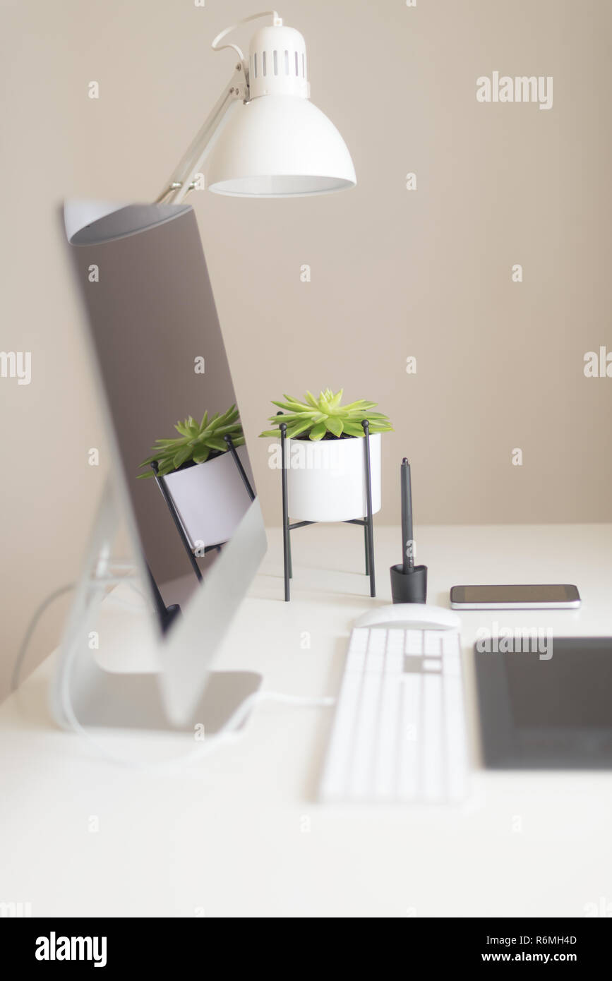 Designer workspace. Minimalistic home office. Blank screen desktop ...