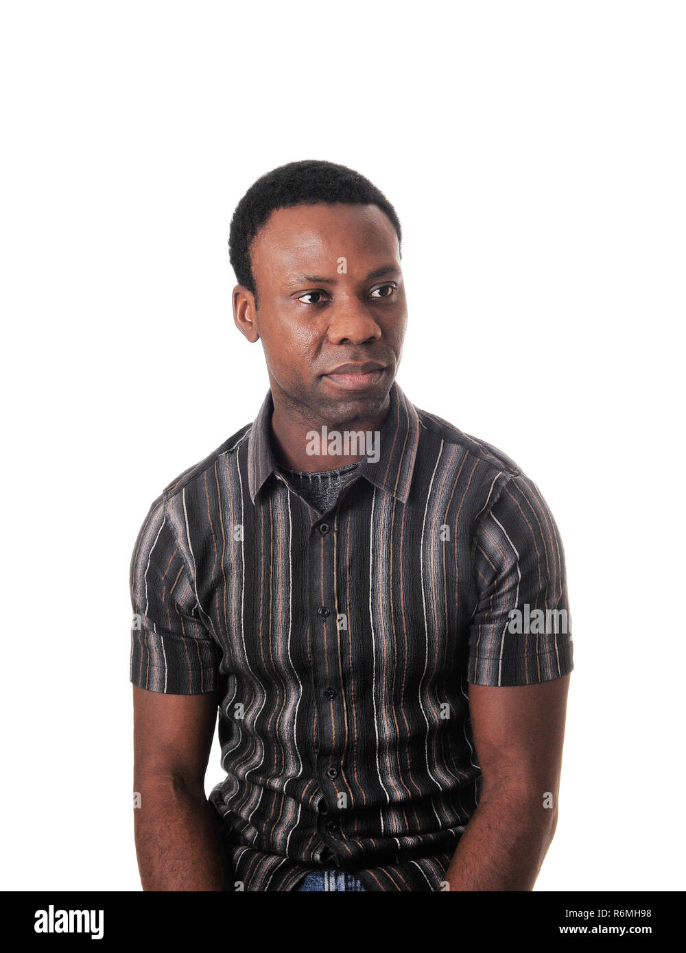 Portrait image of African man sitting Stock Photo - Alamy