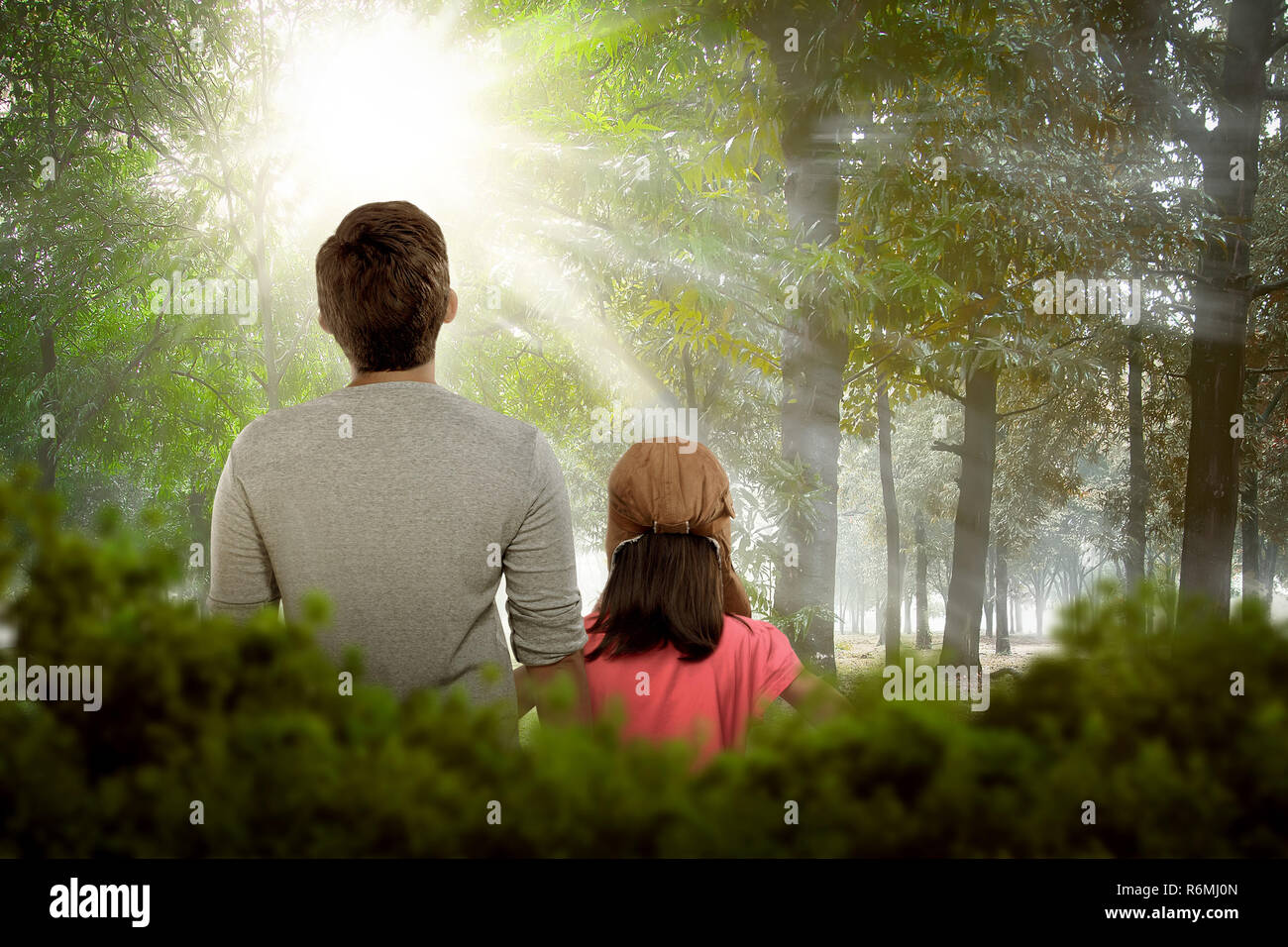 Back view of daughter and father relaxing together Stock Photo - Alamy
