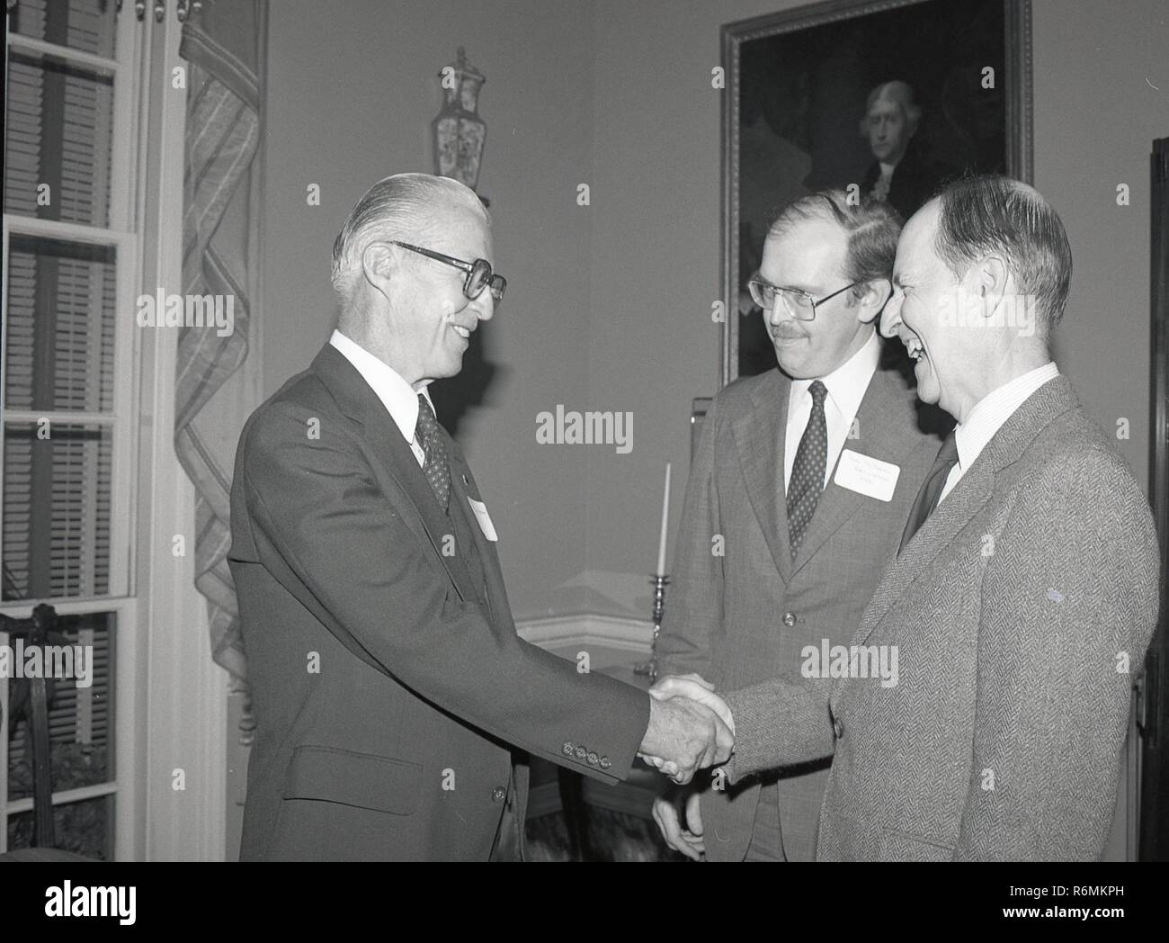 men shaking hands and talking Stock Photo - Alamy