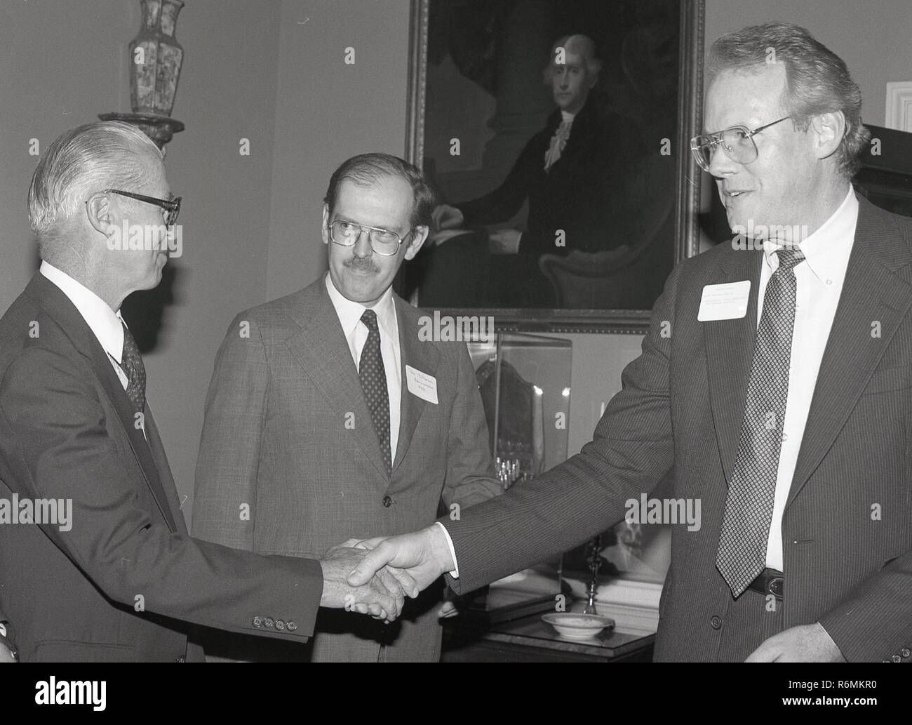 men shaking hands and talking Stock Photo - Alamy