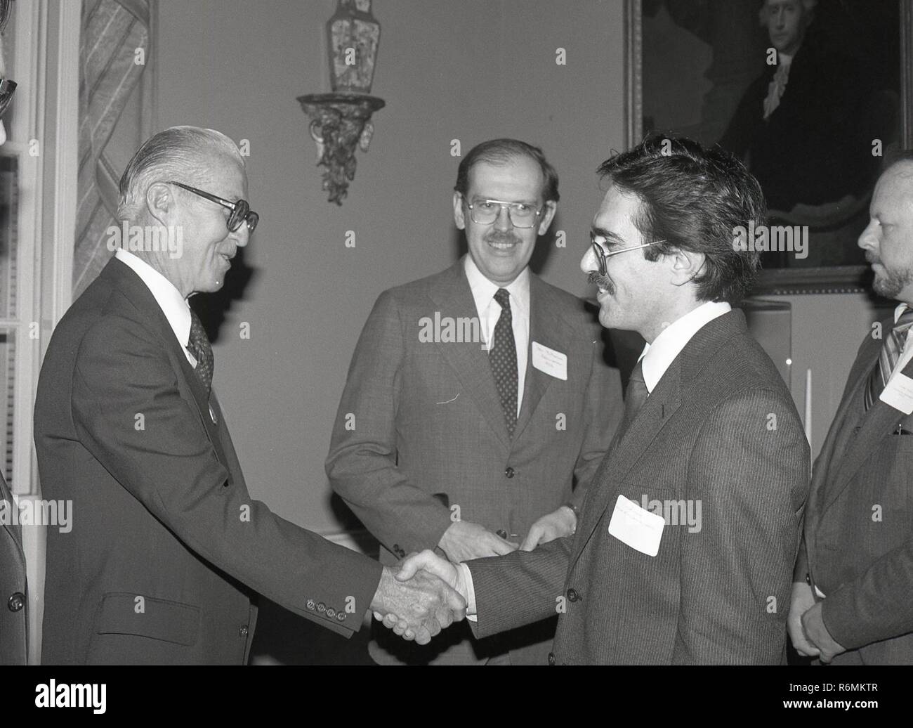 men shaking hands and talking Stock Photo - Alamy