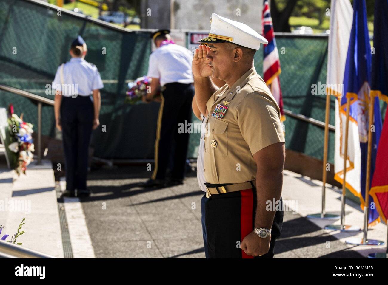 U.S. Marine Brig. Gen. Brian W. Cavanaugh salutes the U.S. Marine Corps ...