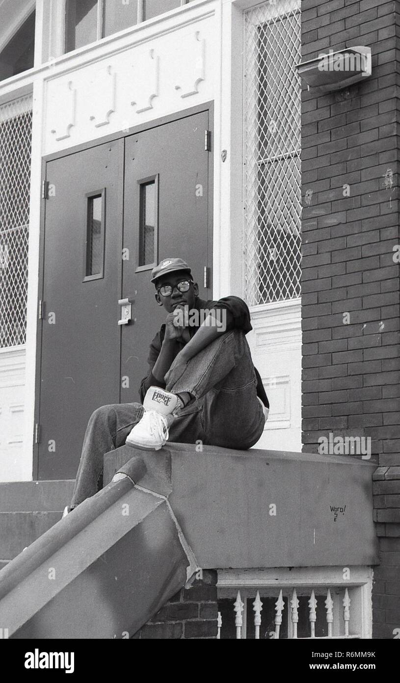 man sitting on stoop Stock Photo - Alamy