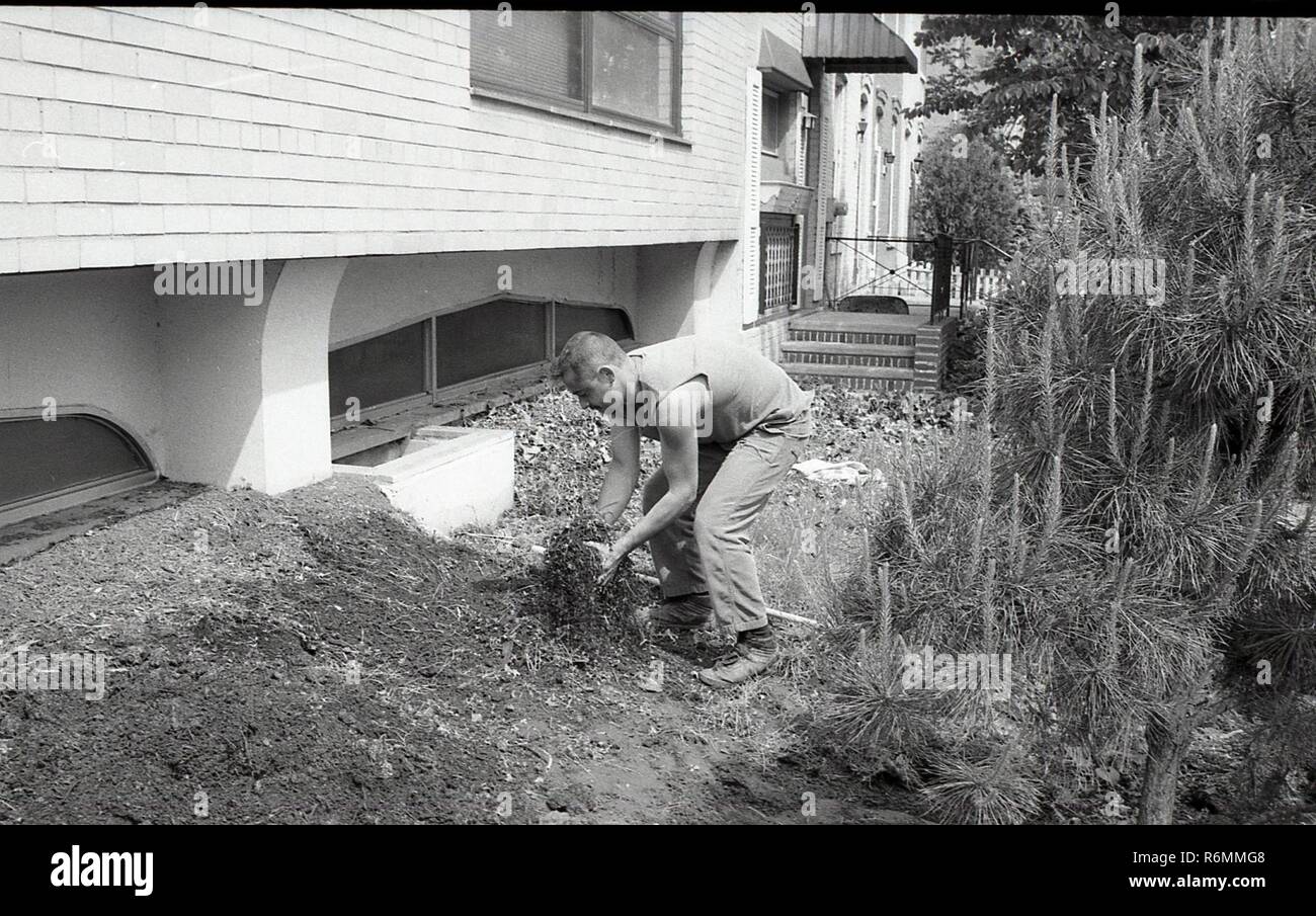 man digging up dirt Stock Photo - Alamy