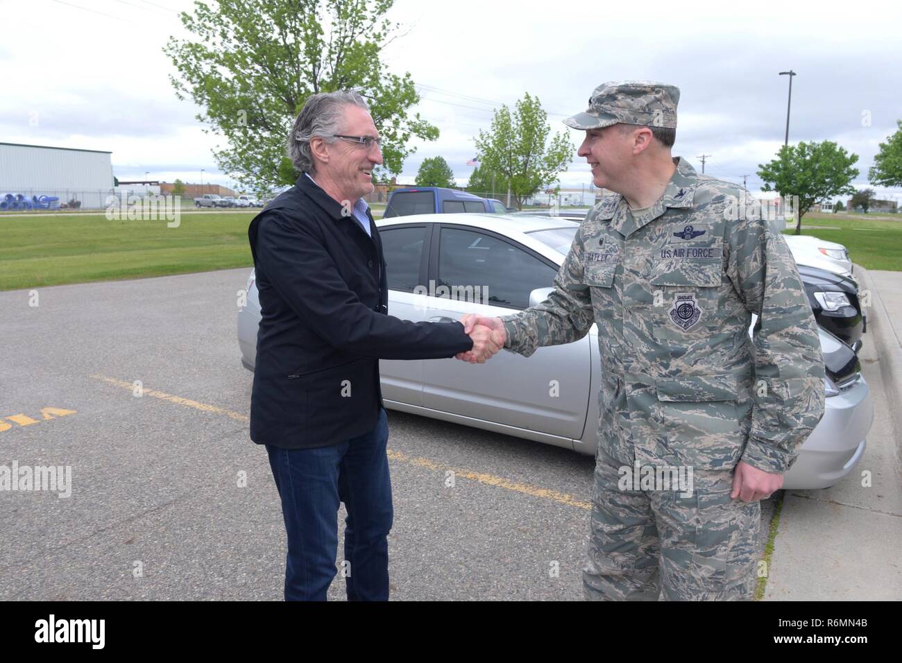 Col. Britt Hatley, the 119th Wing commander, right, greets N.D. Gov ...