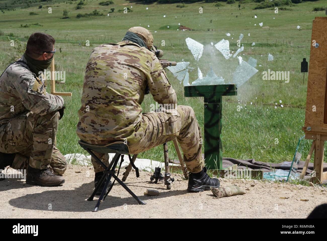HOHENFELS, Germany -- Snipers engage 100m targets through glass panels ...