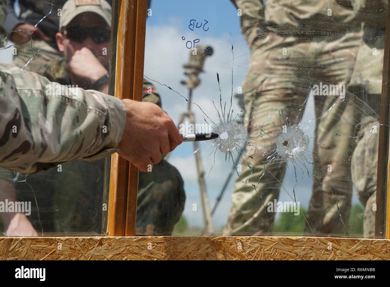HOHENFELS, Germany -- Snipers look at details of engaging 100m targets ...