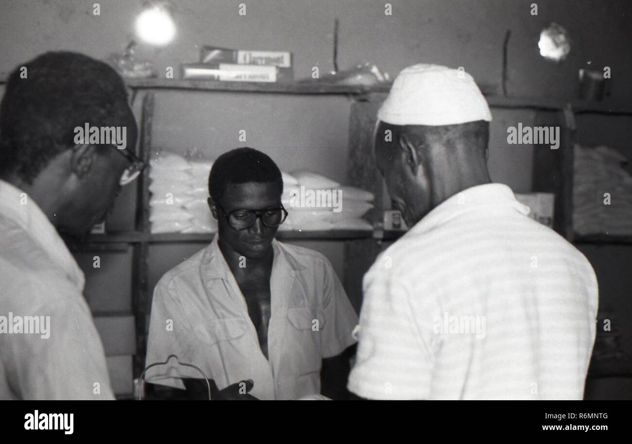 A group of men observing objects Stock Photo - Alamy