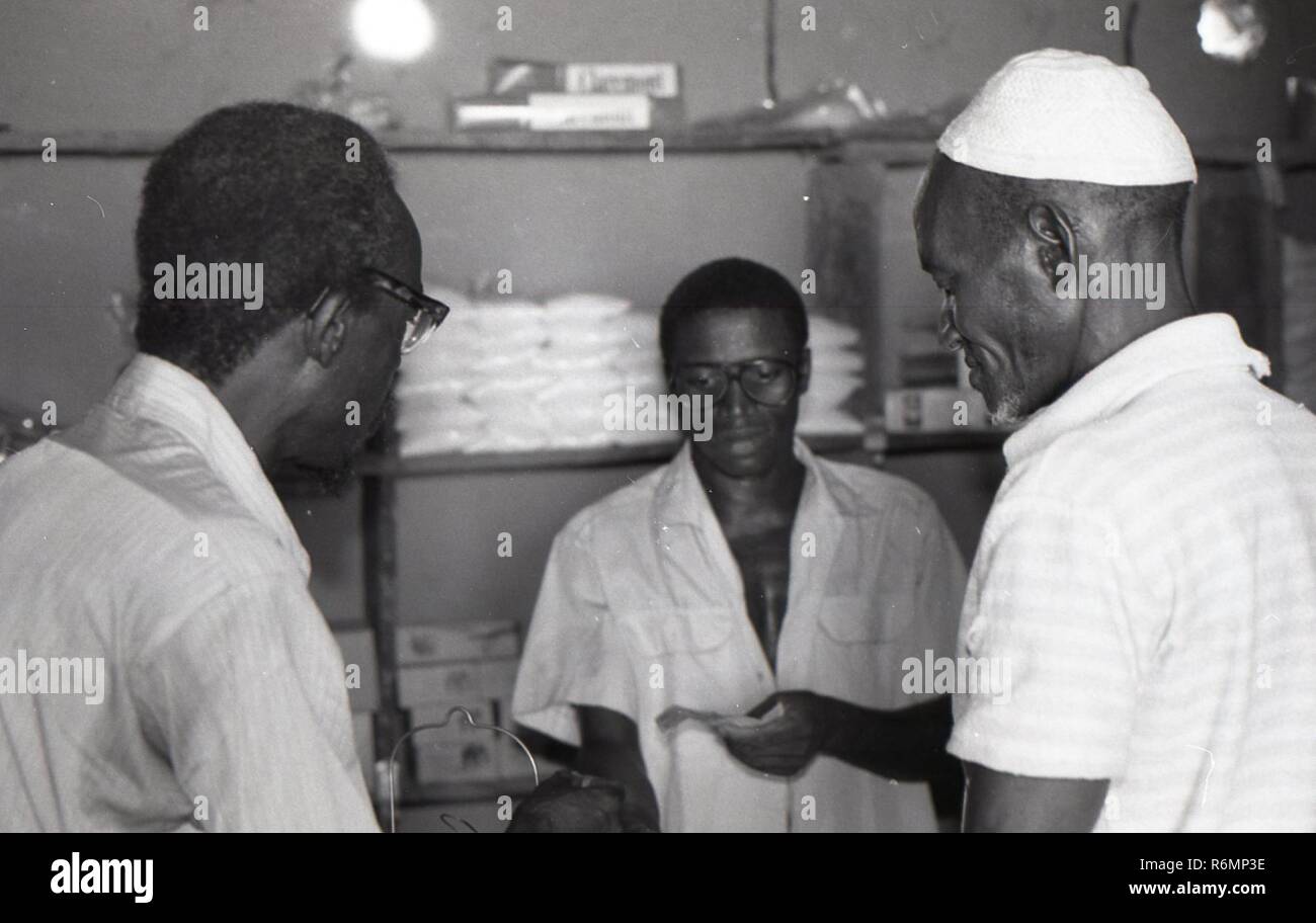 A group of men observing objects Stock Photo - Alamy