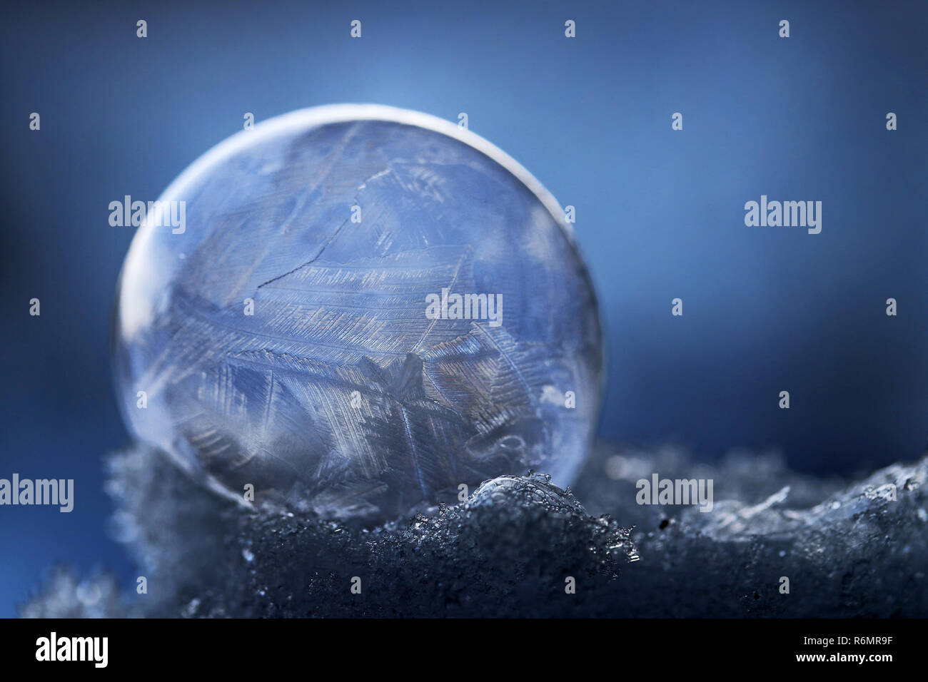 a frozen soap bubble on snow is a beautiful natural piece of art Stock ...