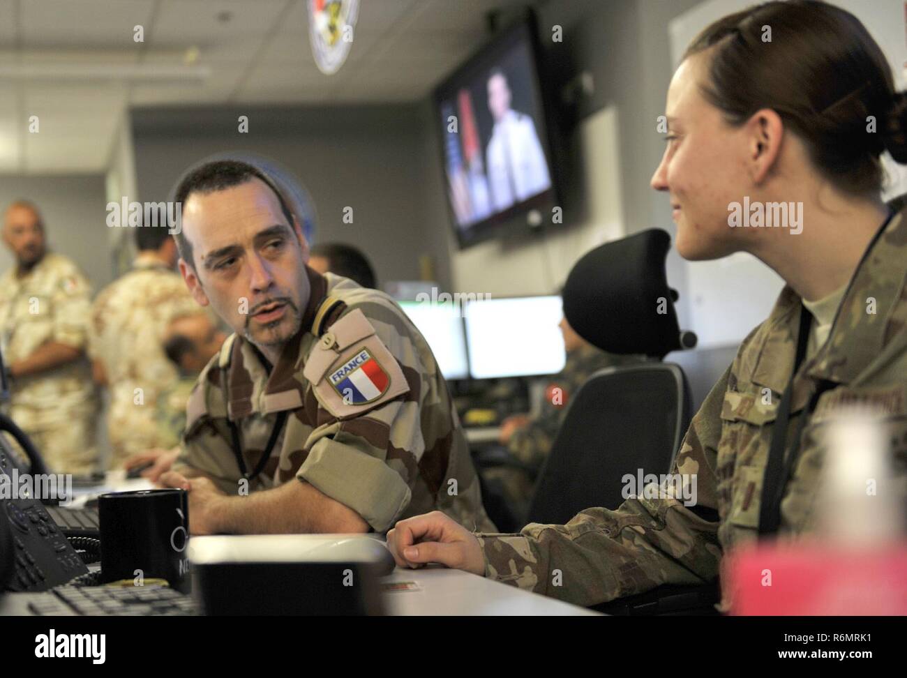 A member of the French air force speaks with a U.S. Airman in the ...