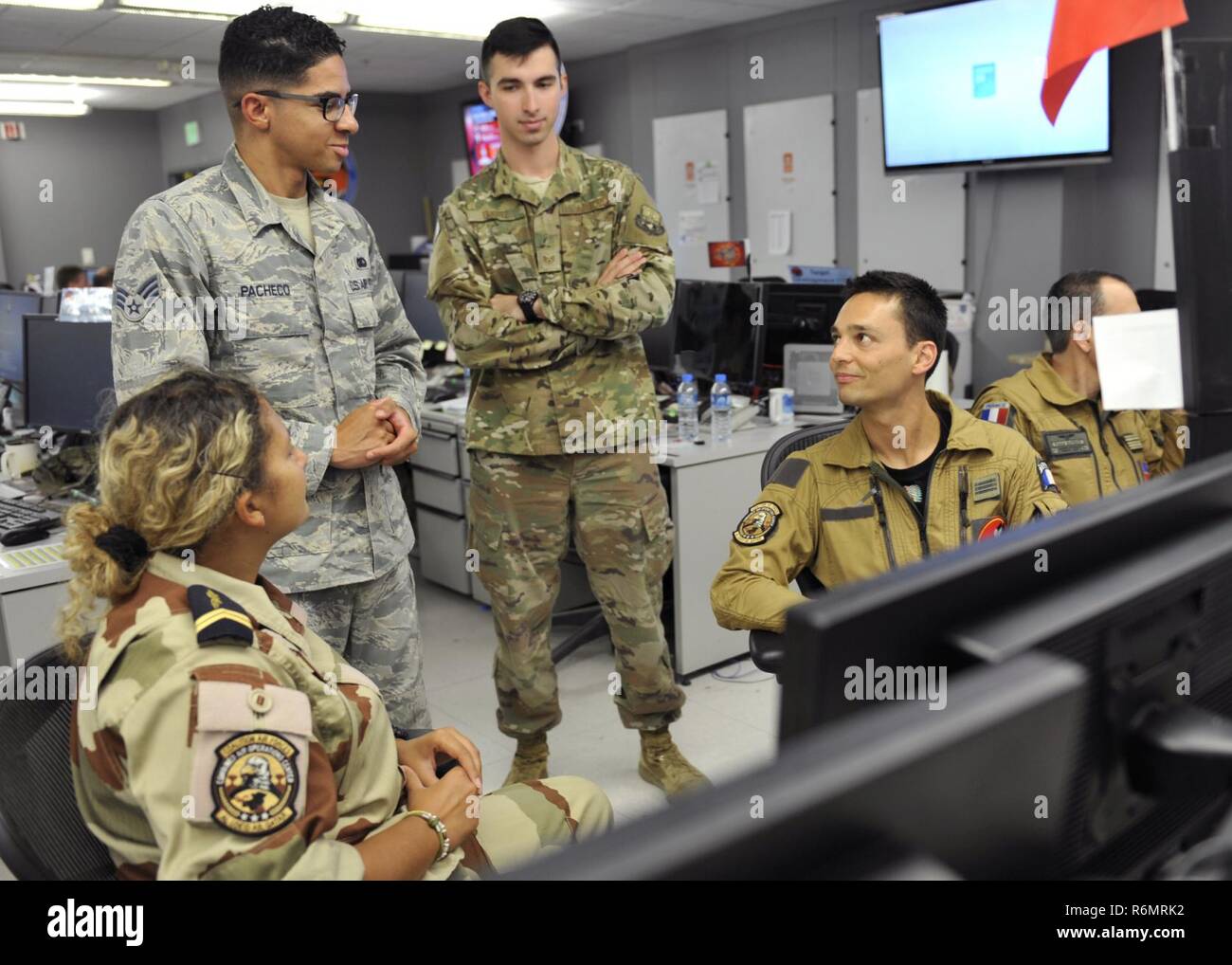 Members of the French air force speak with U.S. Airmen in the Combined ...