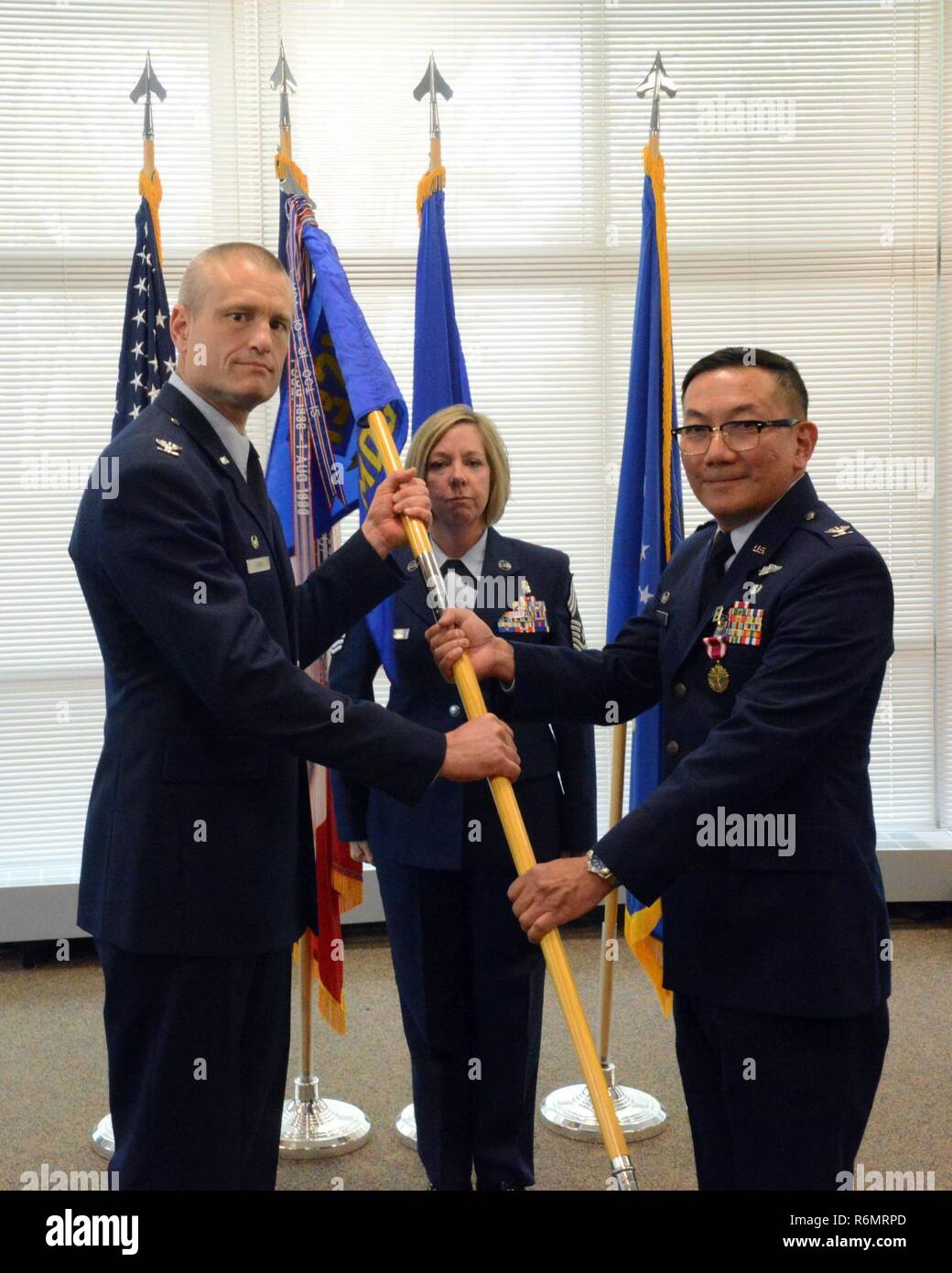 Col. Jim P. Duong (right), 132d Wing (132 WG) outgoing Medical Group ...