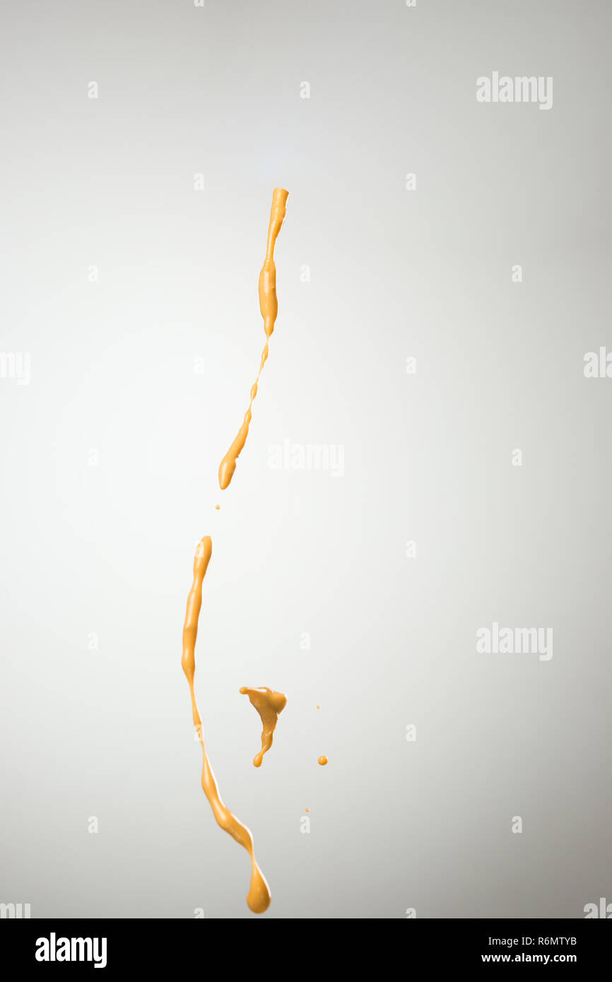 Cooking oil splash on gray background Stock Photo - Alamy