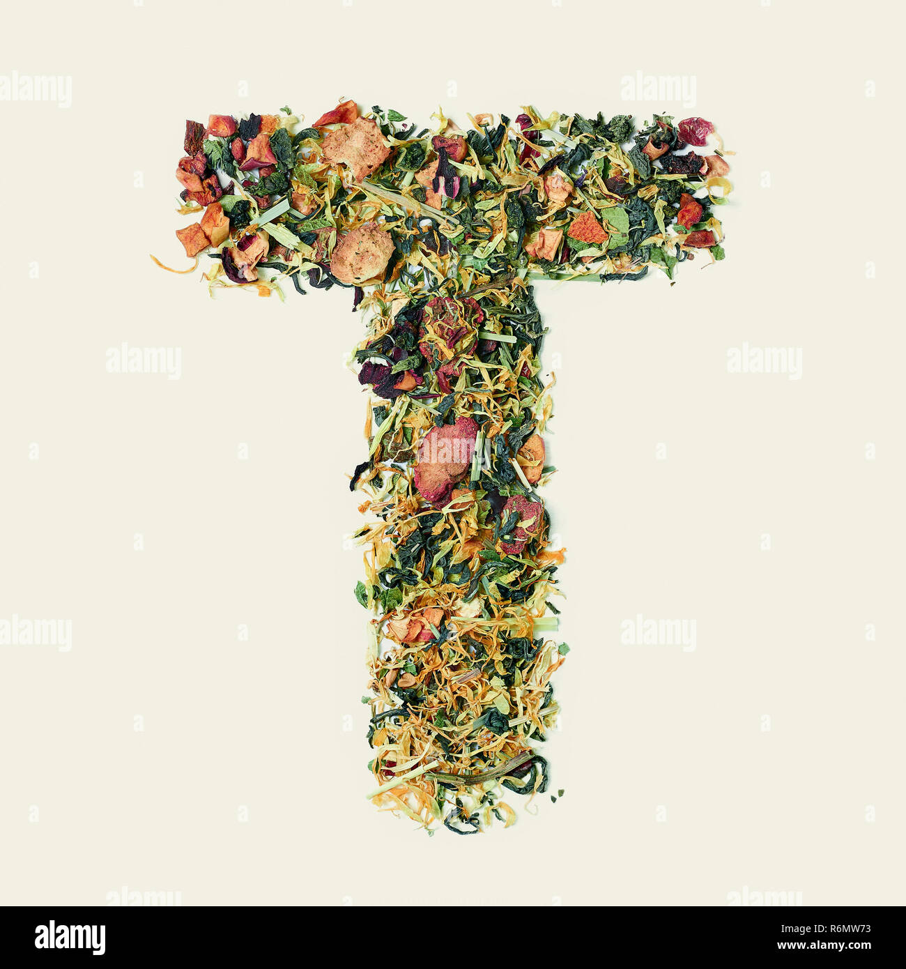 Tea leaf with flowers and fruits, letter T on white background, top ...