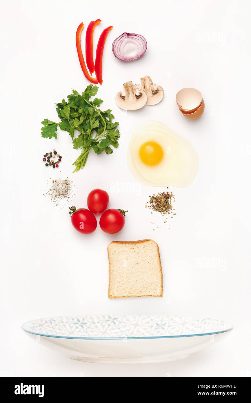 The falling ingredients of fried egg. Healthy breakfast ingredients ...