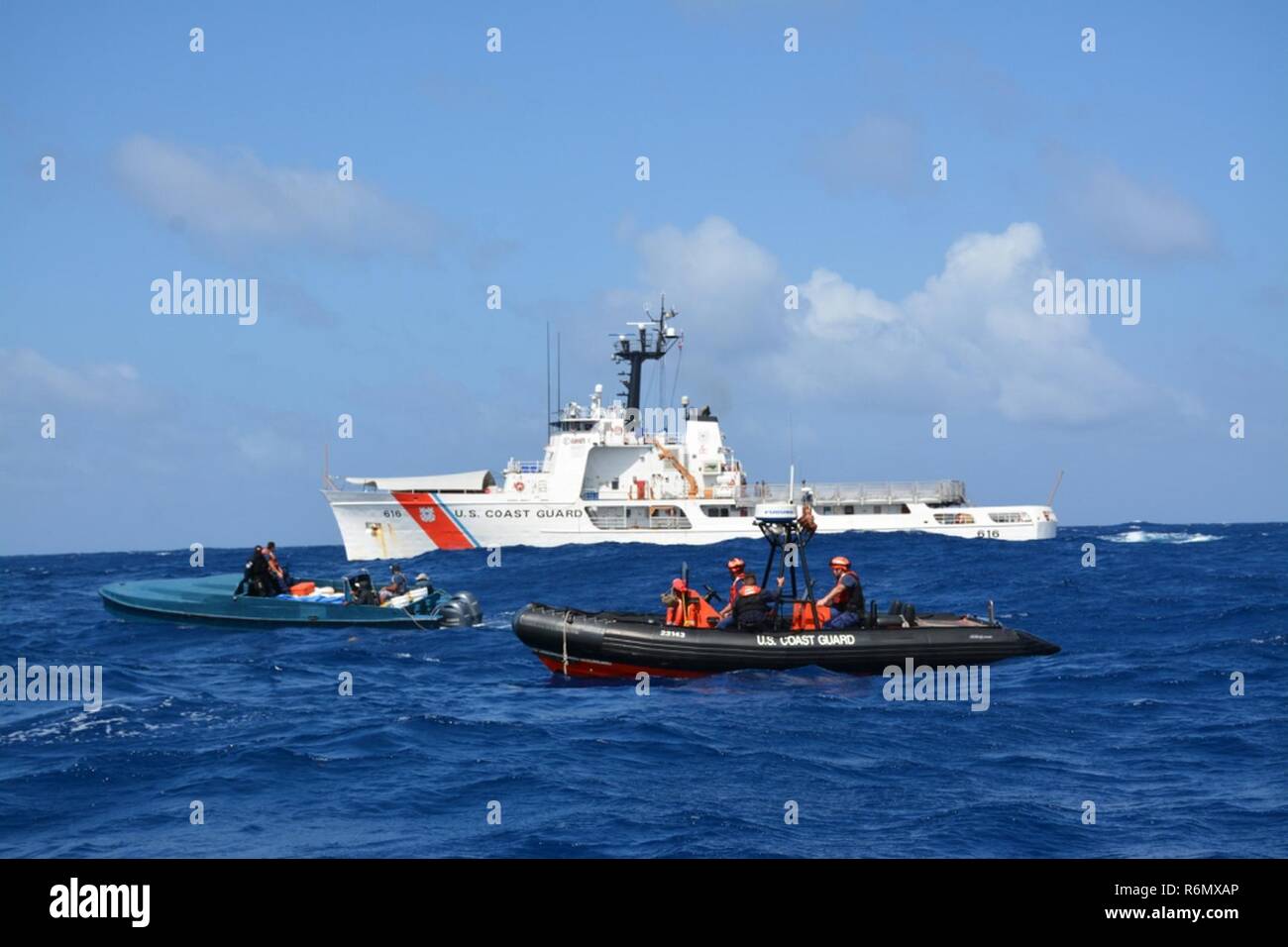 A Coast Guard Cutter Diligence pursuit team interdicts a "go-fast" boat ...
