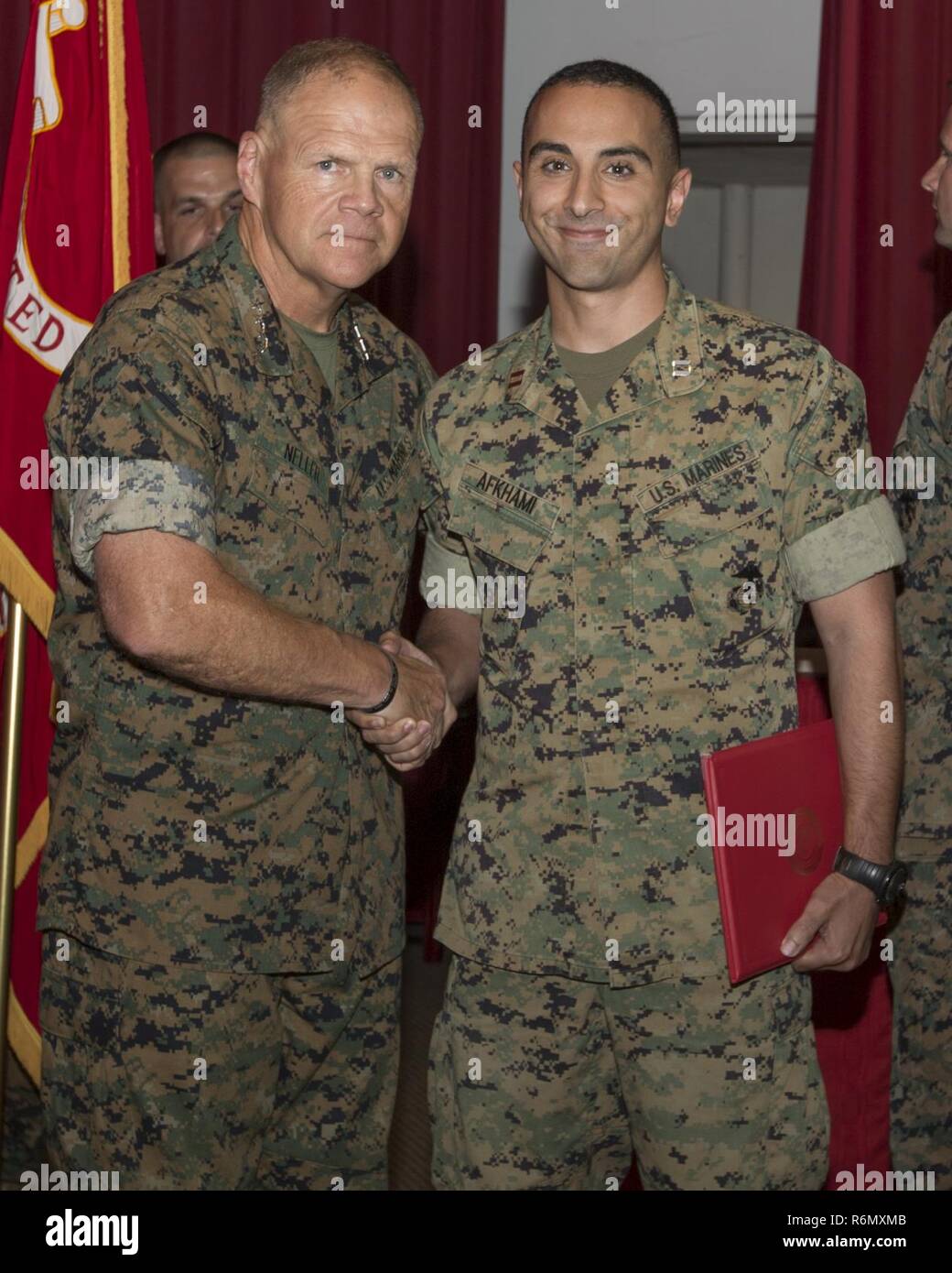 Commandant of the Marine Corps Gen. Robert B. Neller, left, shakes ...