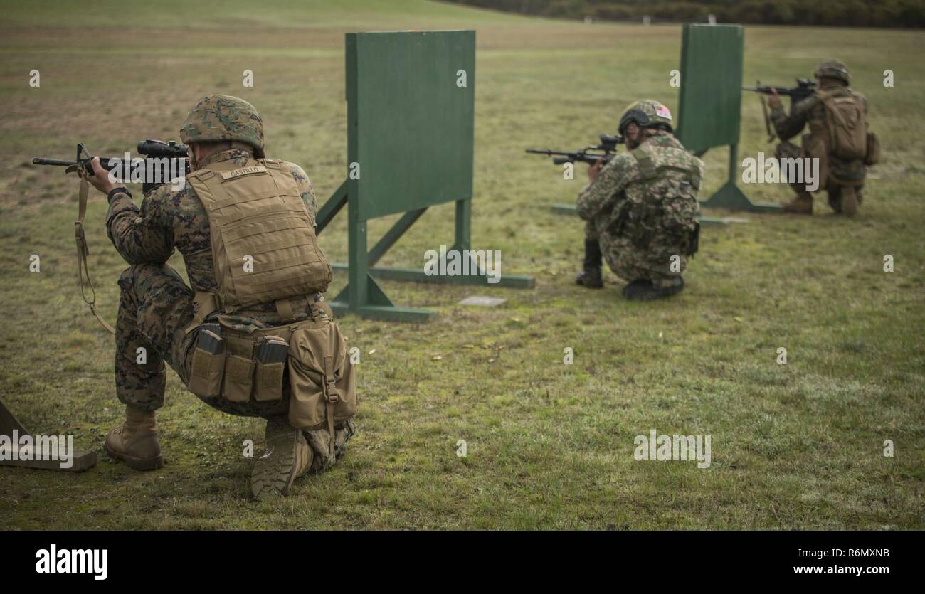 U.S. Marines Capt. Jacob Castillo (left) and Lance Cpl. Samuel Sly ...