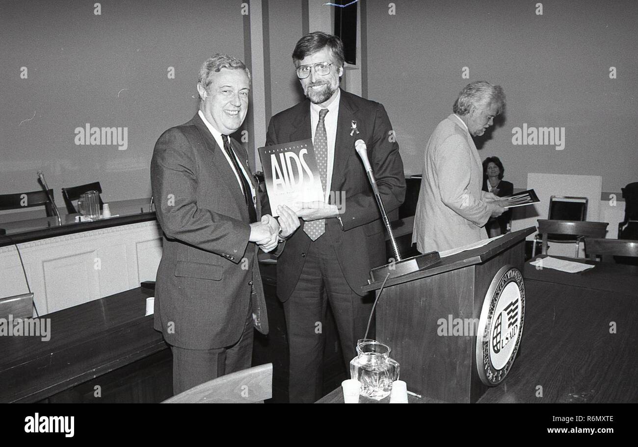USAID REPORT TO CONGRESS - USAID members displaying AIDS book from ...