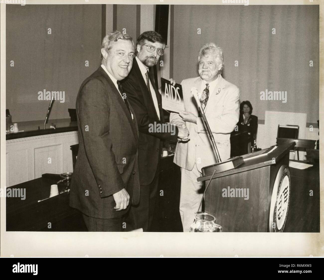 USAID REPORT TO CONGRESS - USAID members displaying AIDS book from ...