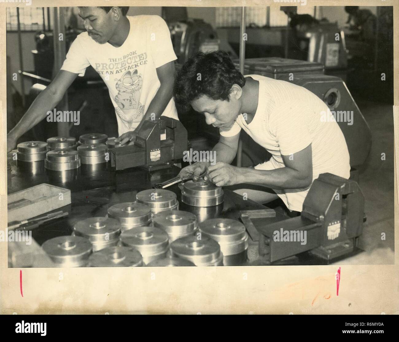 TWO MEN WORKING IN A FACTORY Stock Photo - Alamy