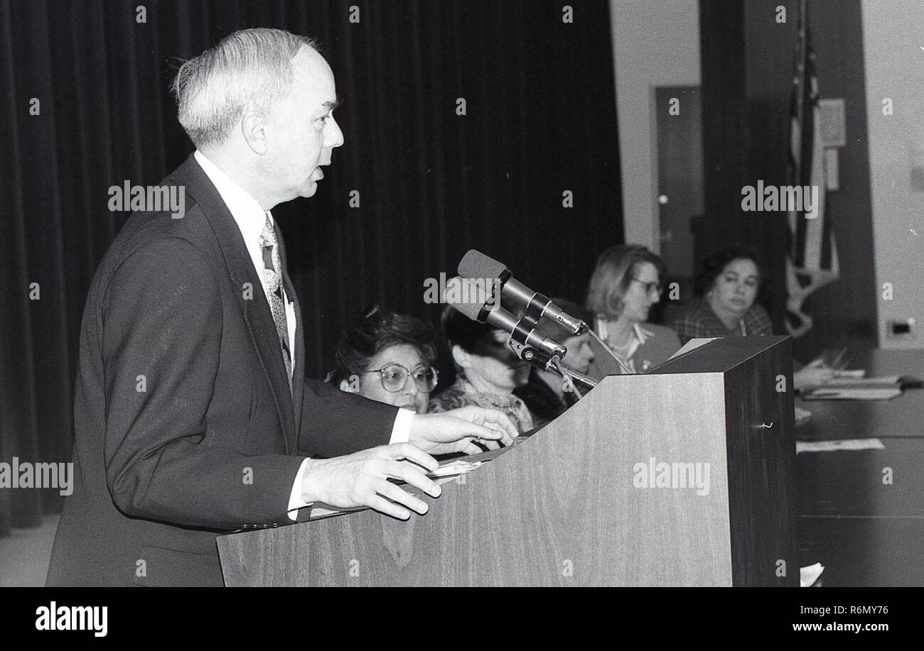 WOMEN'S ACTION ORGANIZATION - Man speaking at podium Stock Photo - Alamy