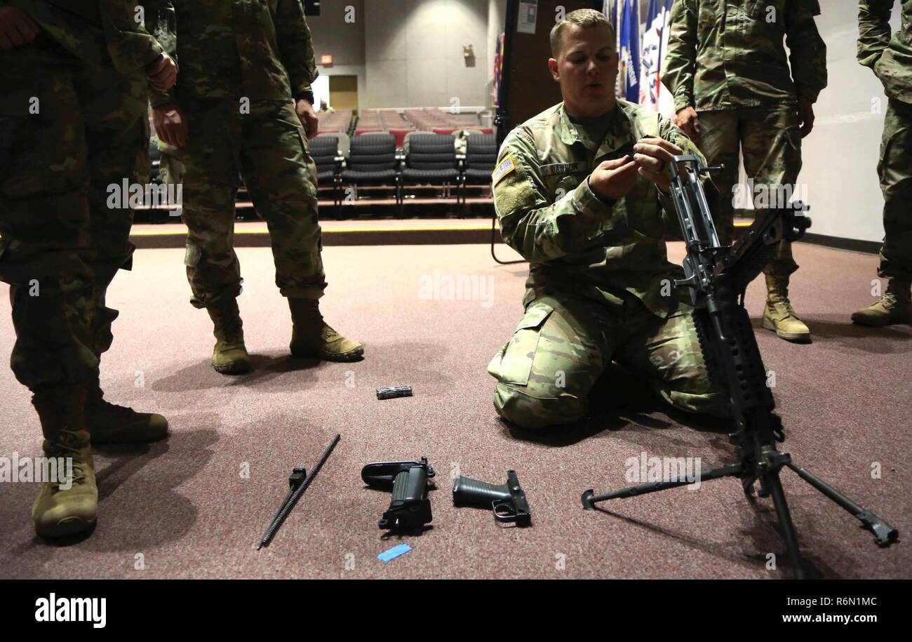 U.S. Army Spc. John Dawson, assigned to 40th Expeditionary Signal ...