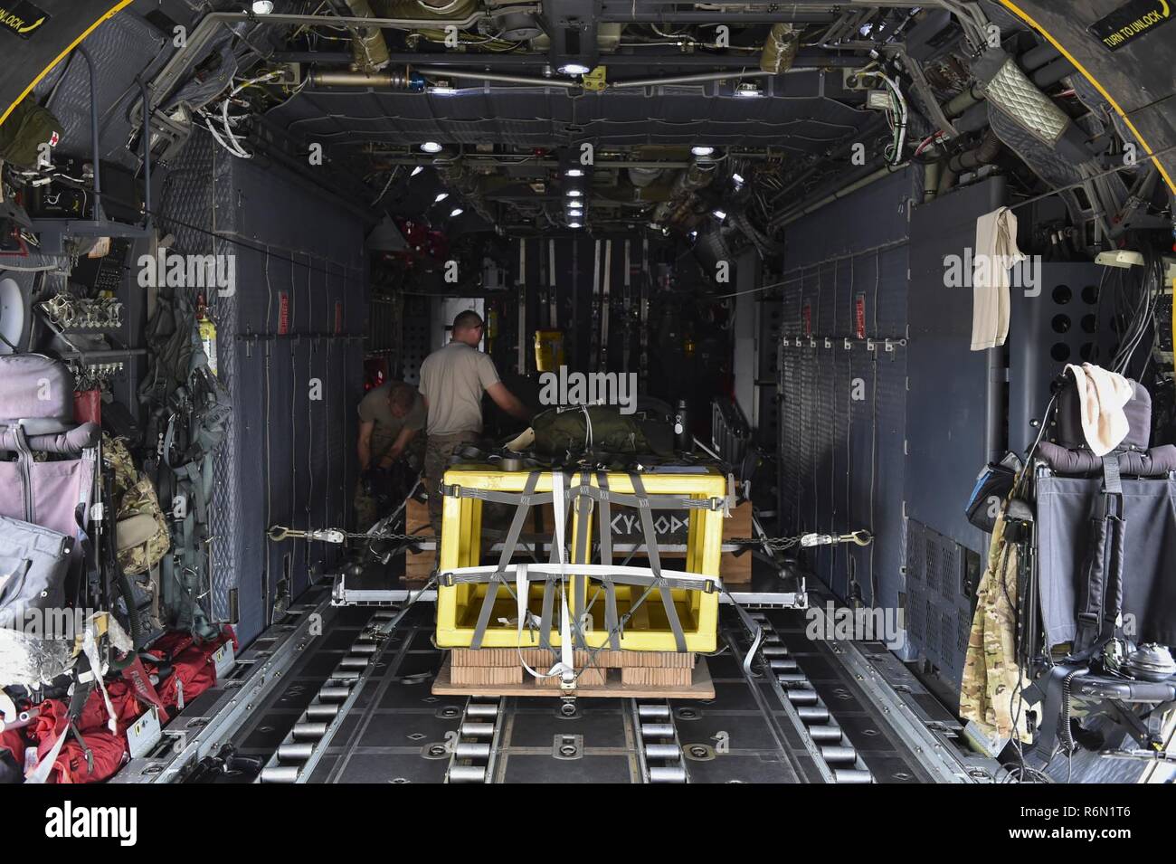 Loadmasters with the 15th Special Operations Squadron secure cargo ...