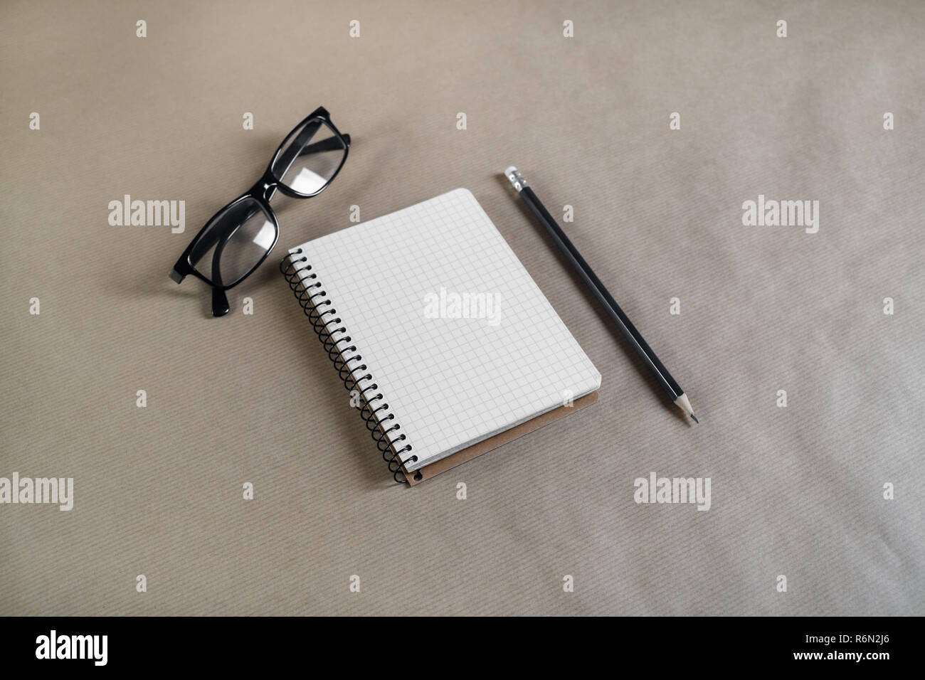 Notebook, pencil and glasses Stock Photo - Alamy