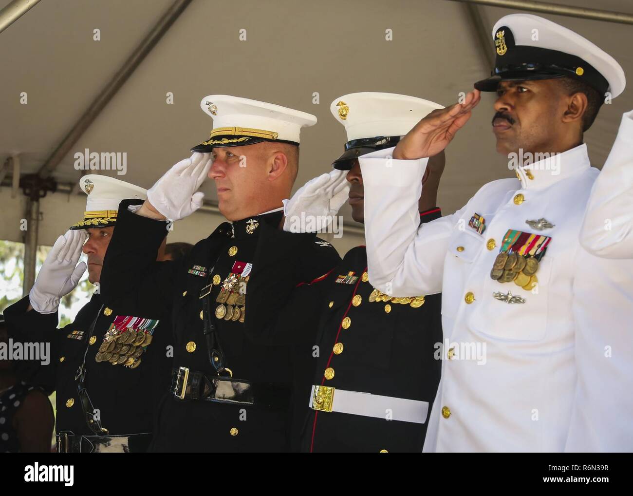 The Tri-command leadership salute during the national anthem during the ...