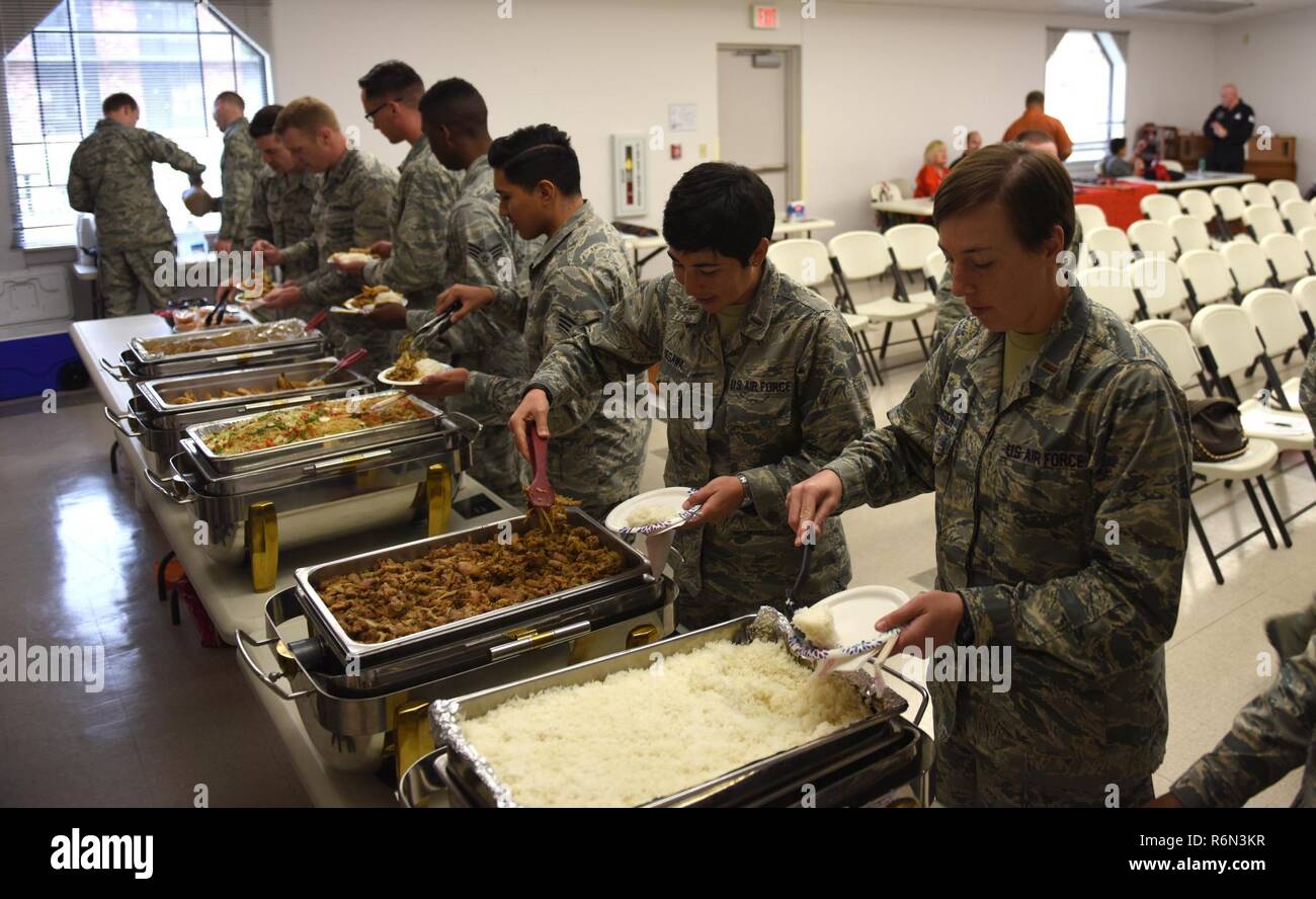 Airmen plate food at an Asian buffet at the beginning of the Asian ...