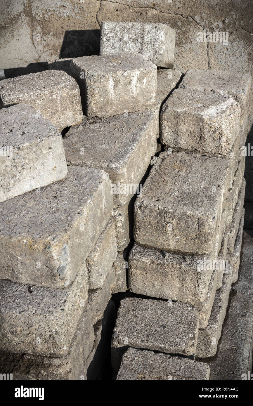 Pile of concrete bricks Stock Photo - Alamy