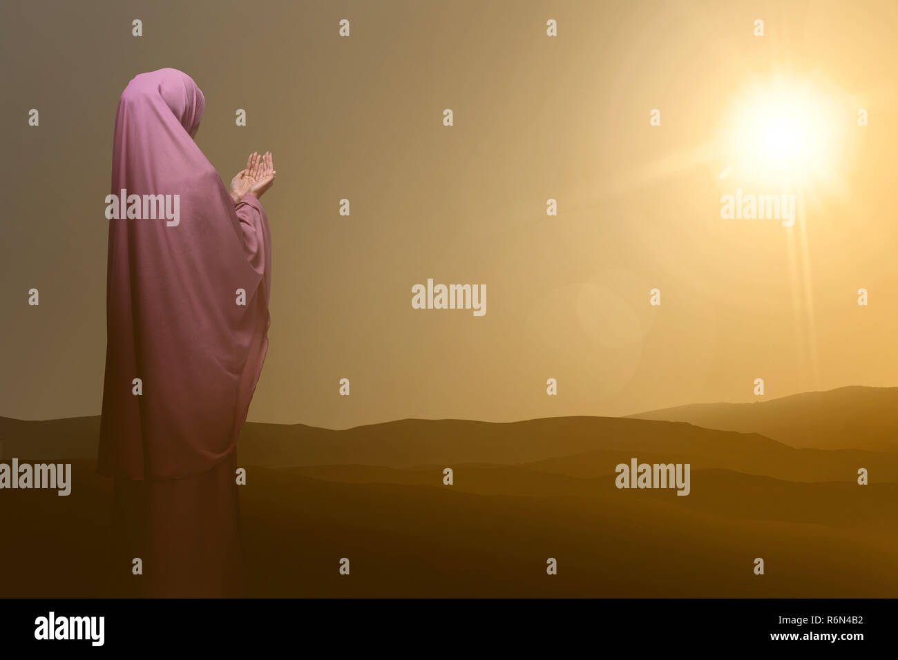 Back view of asian muslim woman praying to god Stock Photo - Alamy