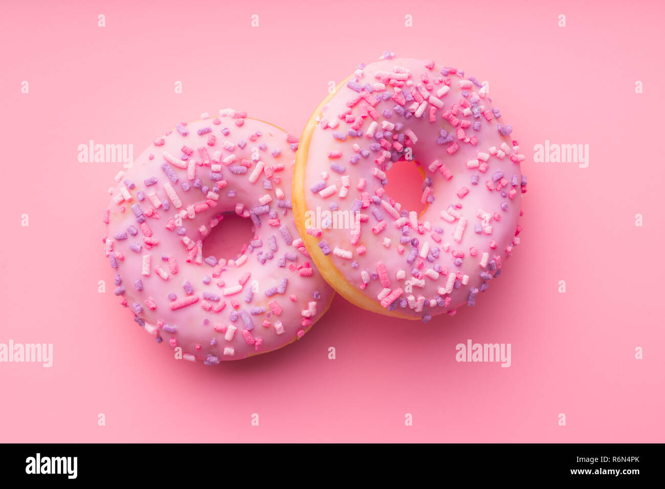 Two pink donuts Stock Photo - Alamy