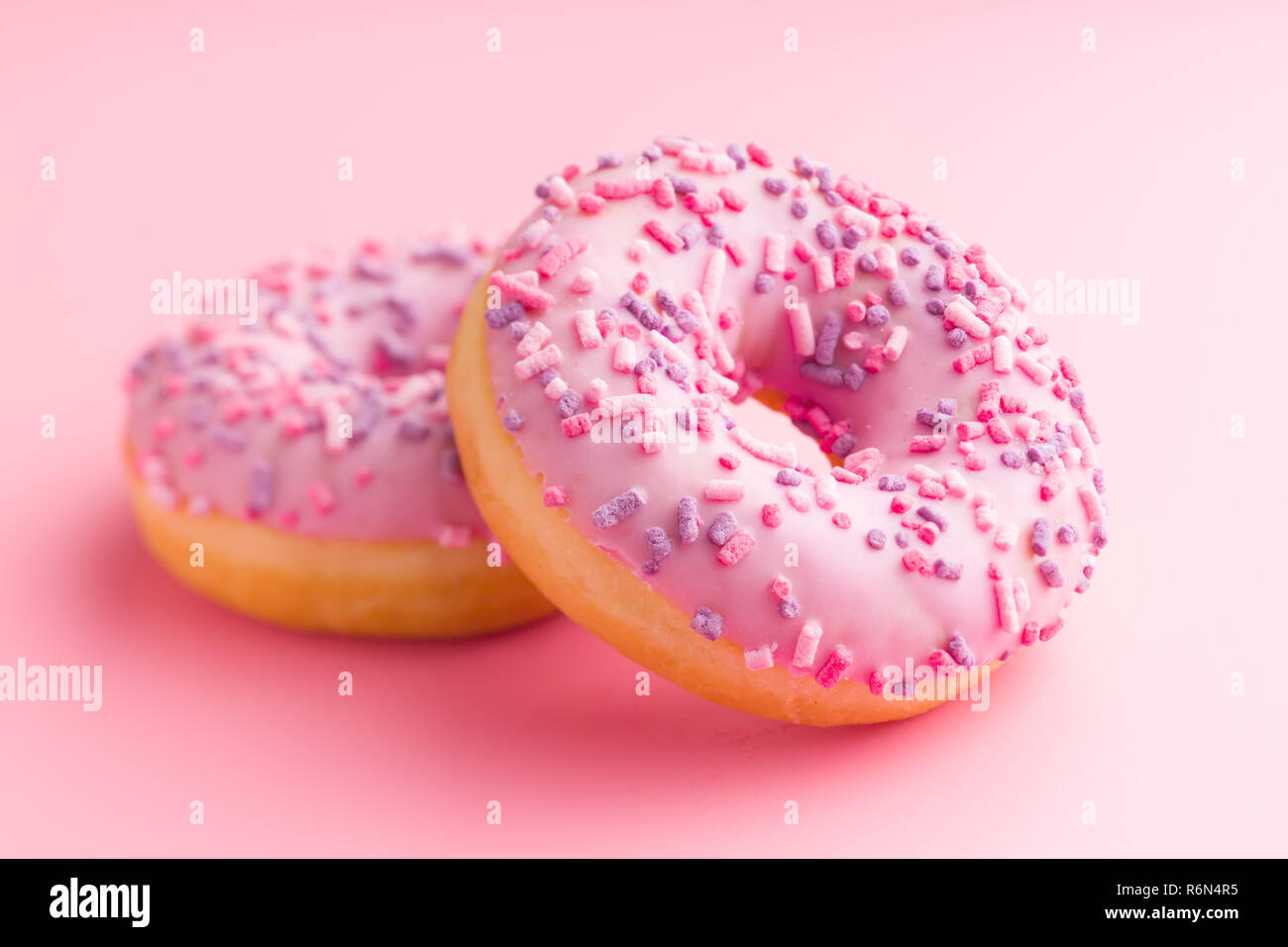 Two pink donuts Stock Photo - Alamy