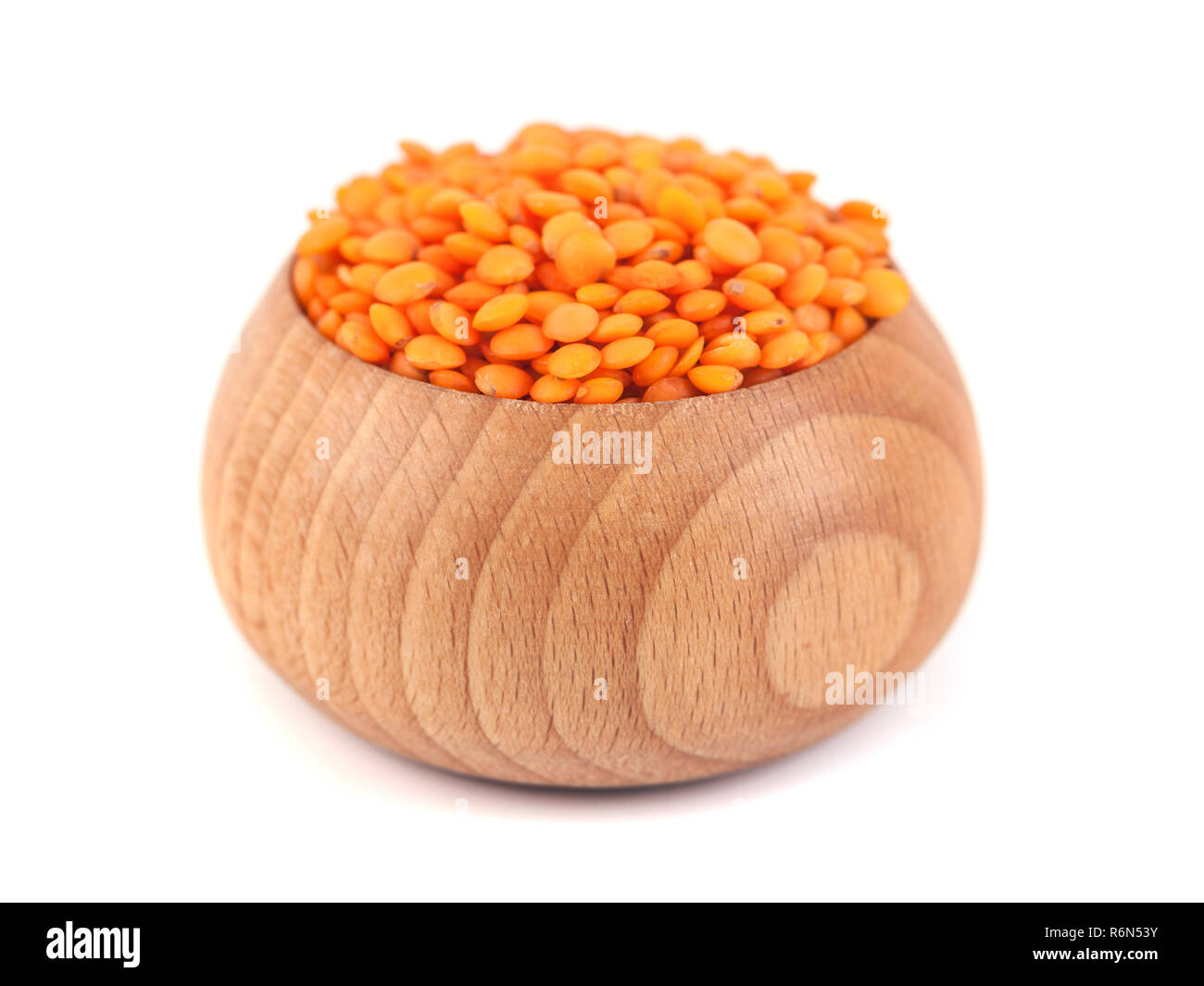 Red lentils in the wooden bowl isolated on white background Stock Photo ...
