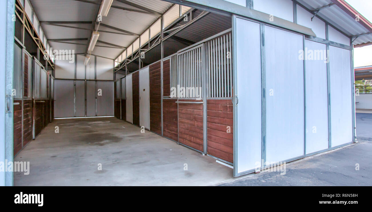 Barn of a home with stalls and large sliding door Stock Photo - Alamy