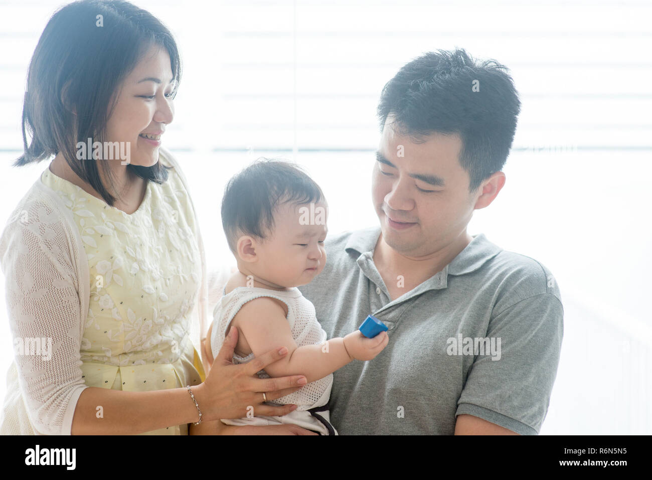 Asian parents and baby Stock Photo - Alamy